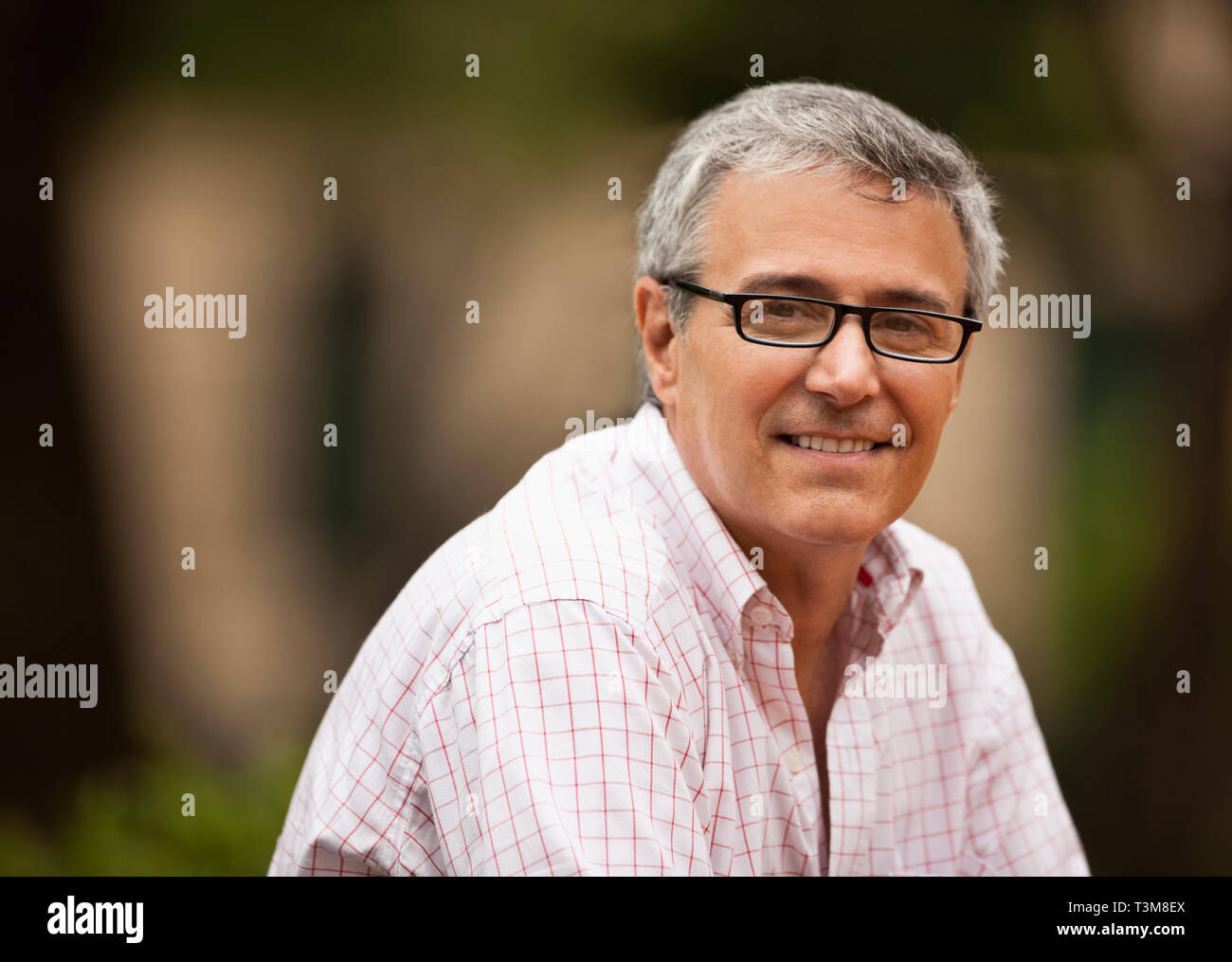 Smiling portrait of professional man Stock Photo - Alamy