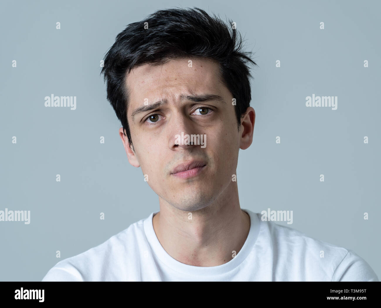 Stressed sad man looking down hi-res stock photography and images - Alamy