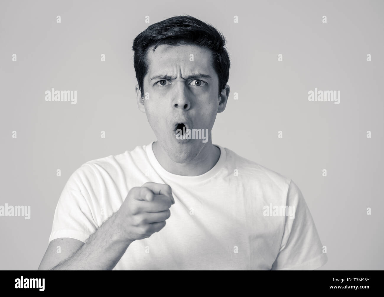 Close up portrait of a handsome caucasian young man with a surprised ...
