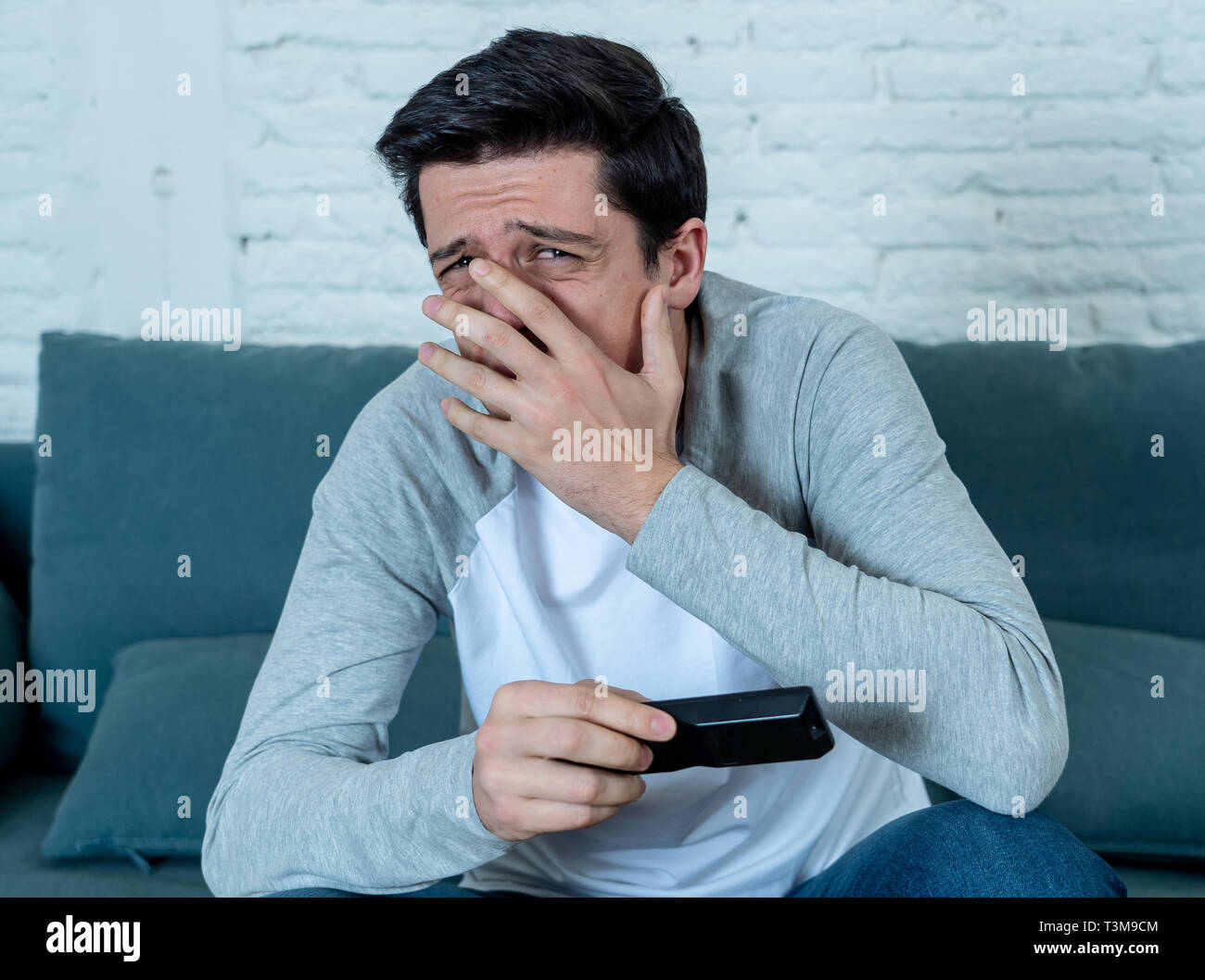 Lifestyle portrait of young man feeling scared and shocked making fear ...