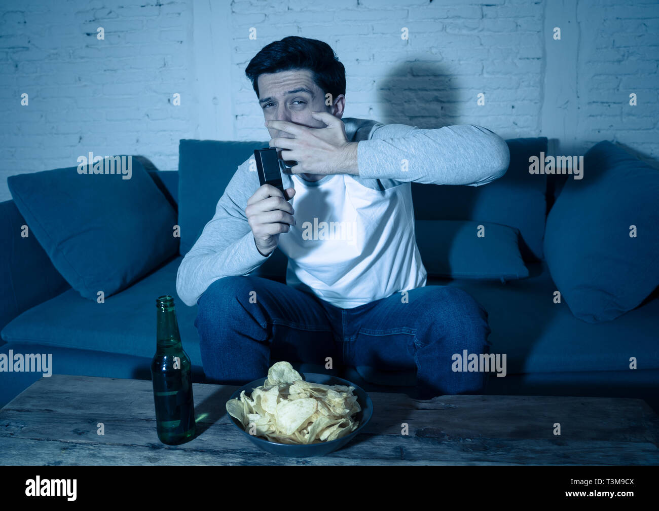 Lifestyle portrait of young man feeling scared and shocked making fear ...