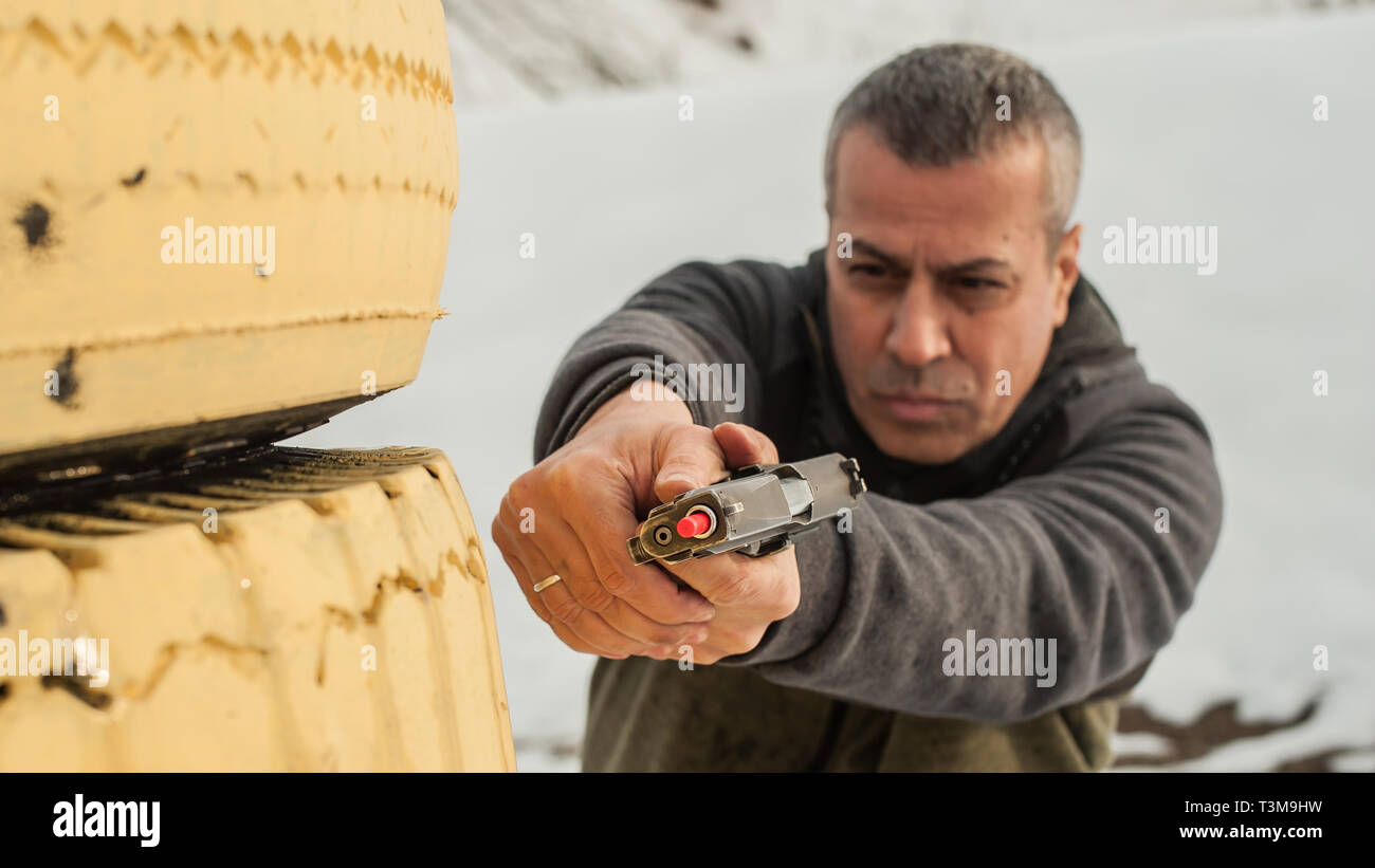 Man holding gun from behind hi-res stock photography and images - Alamy