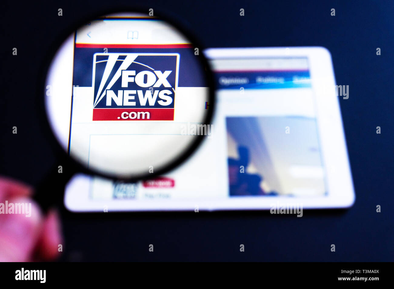 Fox News website homepage on the tablet screen. Fox News channel logo ...