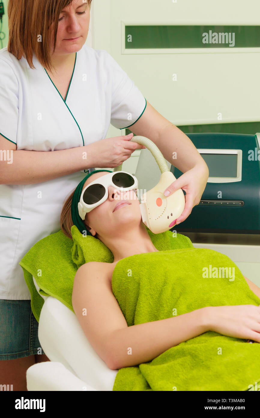 Medical cosmetology, modern cosmetic devices concept. Woman wearing ...