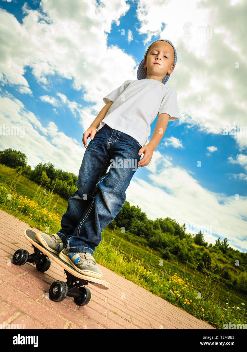 Active childhood. Little man skateboarding. Skater boy child kid with ...