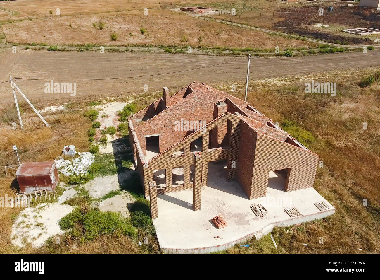 The house is built of red brick. The walls of the house are a top view ...