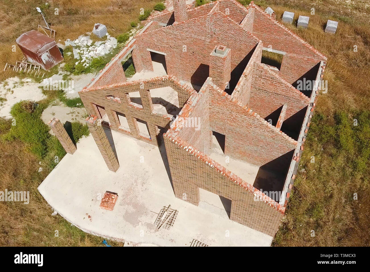 The house is built of red brick. The walls of the house are a top view ...