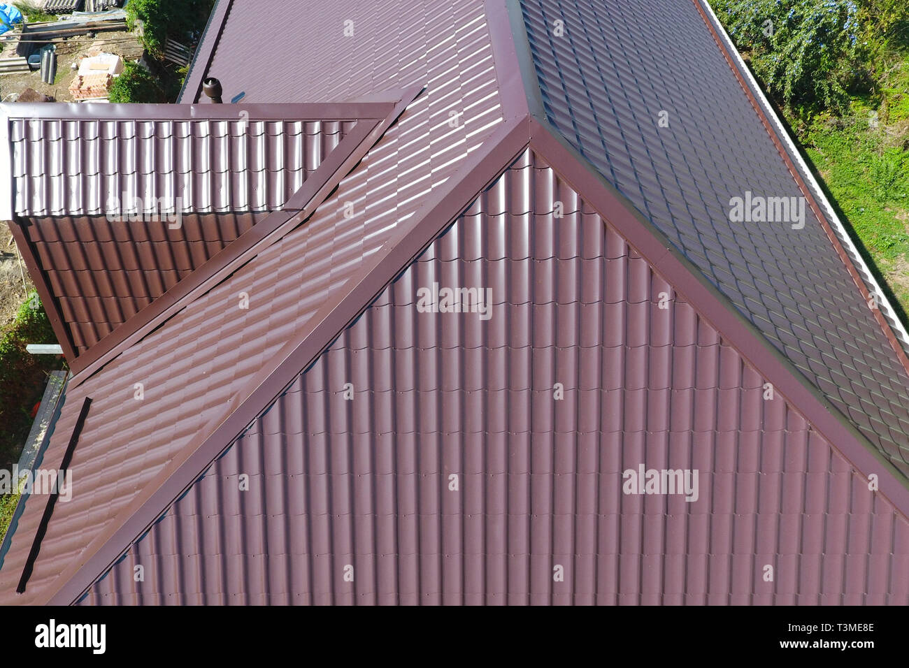 The roof of corrugated sheet. Roofing of metal profile wavy shape. A ...