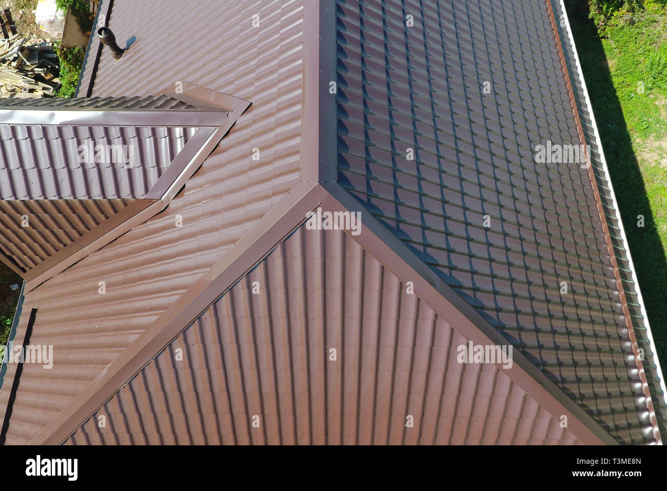 The roof of corrugated sheet. Roofing of metal profile wavy shape. A ...