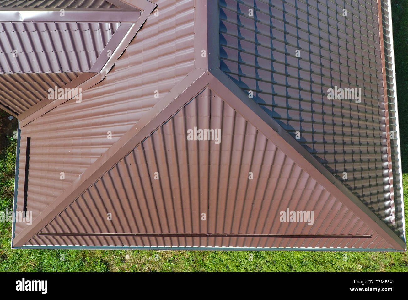 The roof of corrugated sheet. Roofing of metal profile wavy shape. A ...