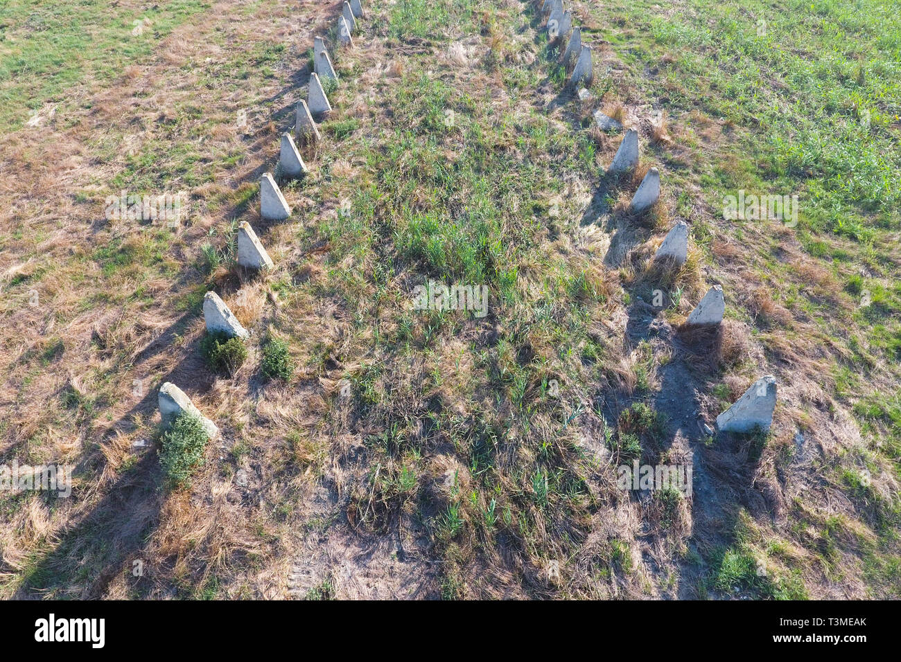The ruins of the old farm. Cones column base of the wall. Abandoned and ...