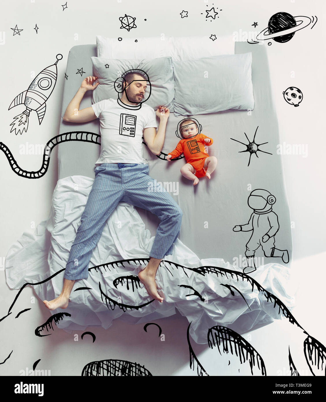 Conquerors of outter space. Top view photo of young man and his child ...