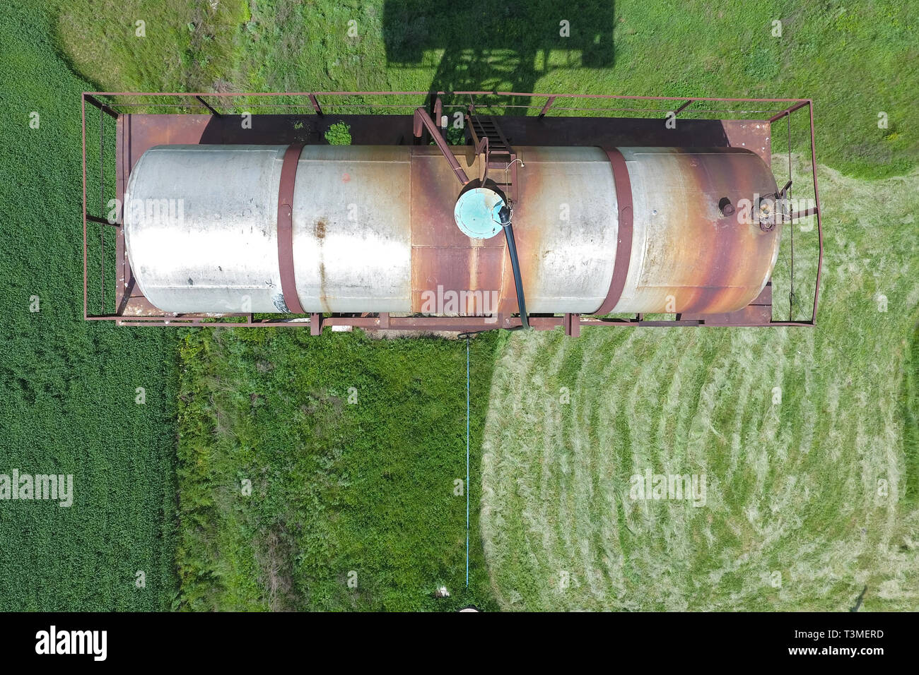 The water tower. An old rustic communal communication Stock Photo - Alamy