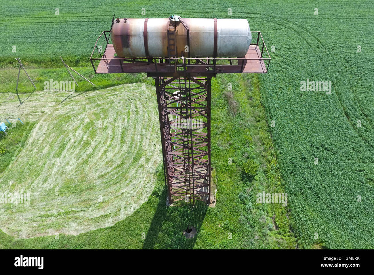 The water tower. An old rustic communal communication Stock Photo - Alamy