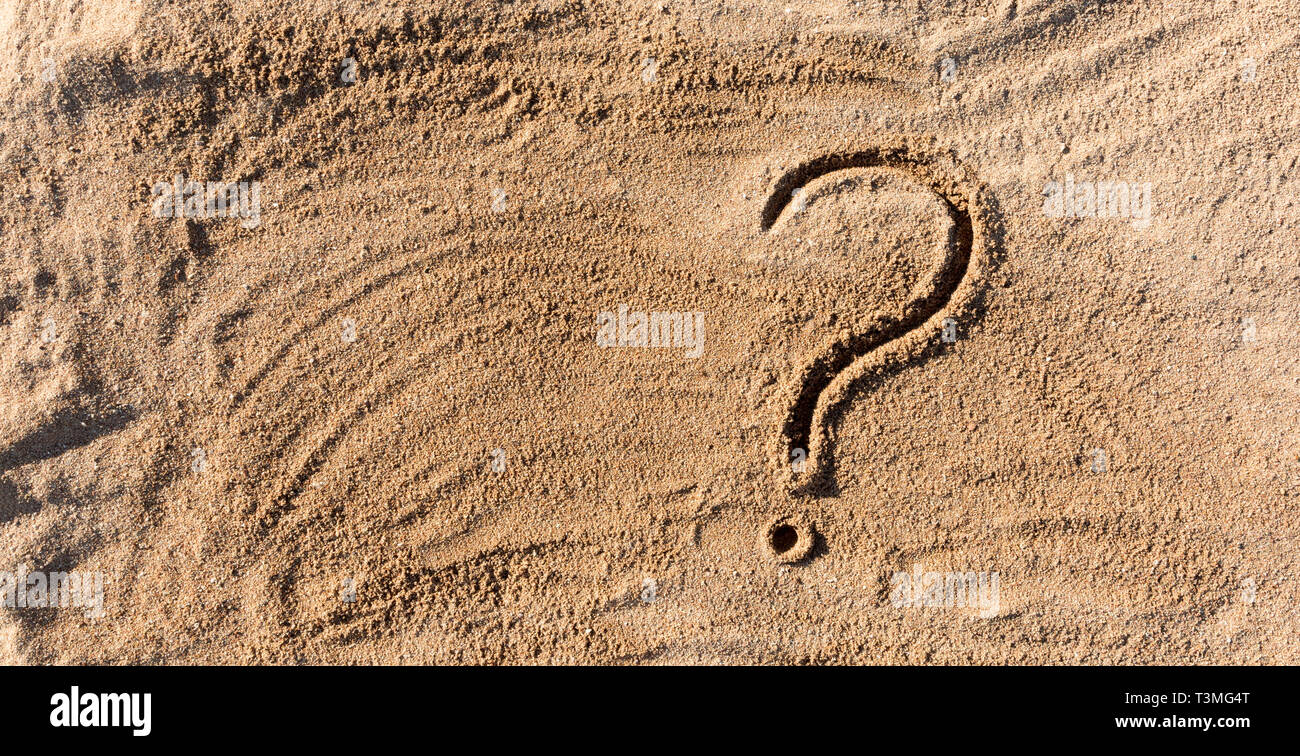 question marks written on beach sand close up, with copy space Stock ...