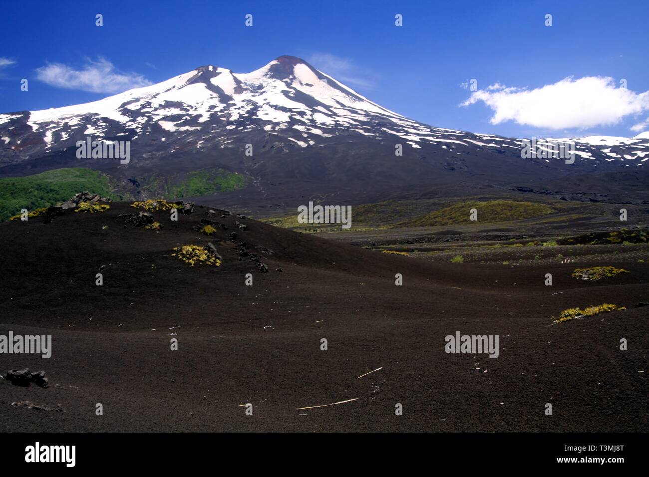 Wide field of volcanic lava ash on peak of black Volcano Llaima with ...
