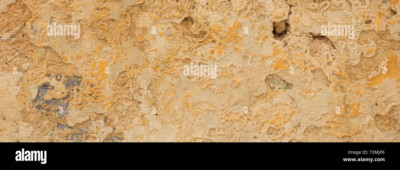 Beige yellow color, painted and faded wall texture grunge background ...