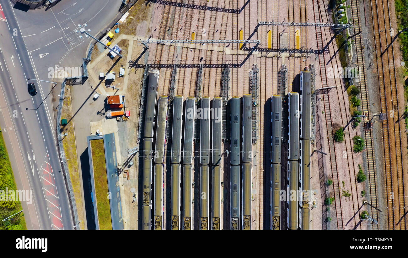 Aerial view over passenger trains in rows at a station Stock Photo - Alamy