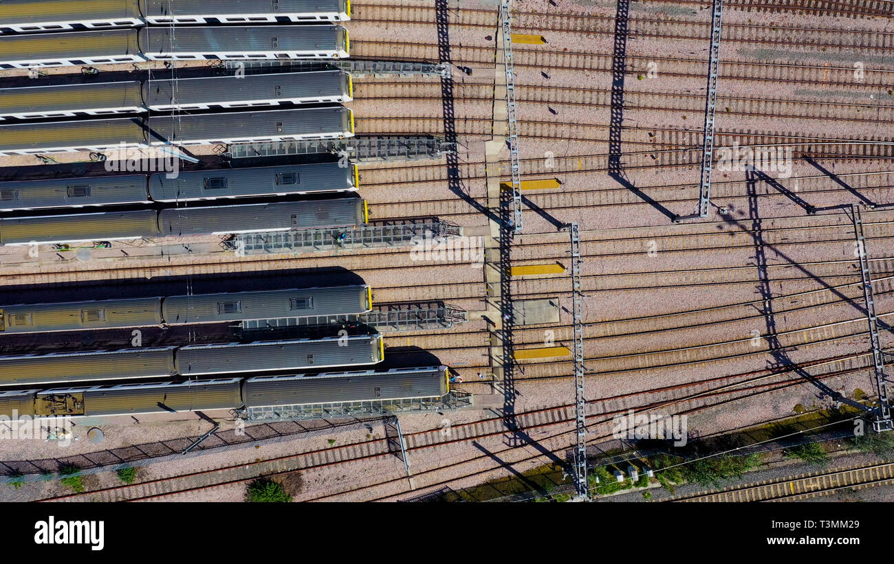 Aerial view over passenger trains in rows at a station Stock Photo - Alamy
