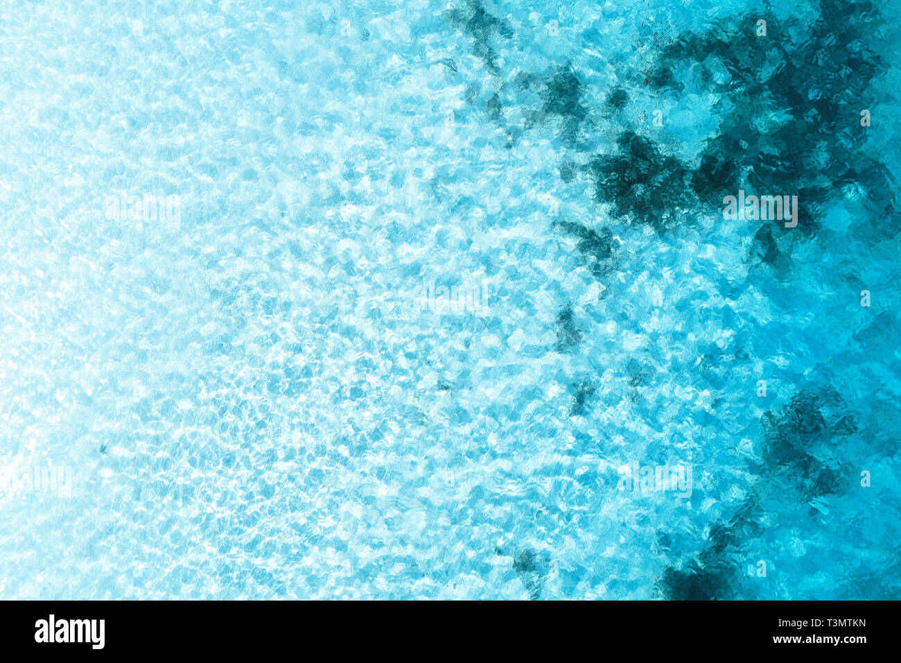Aerial view of the blue sea at sunny bright day. Top view of the clear ...
