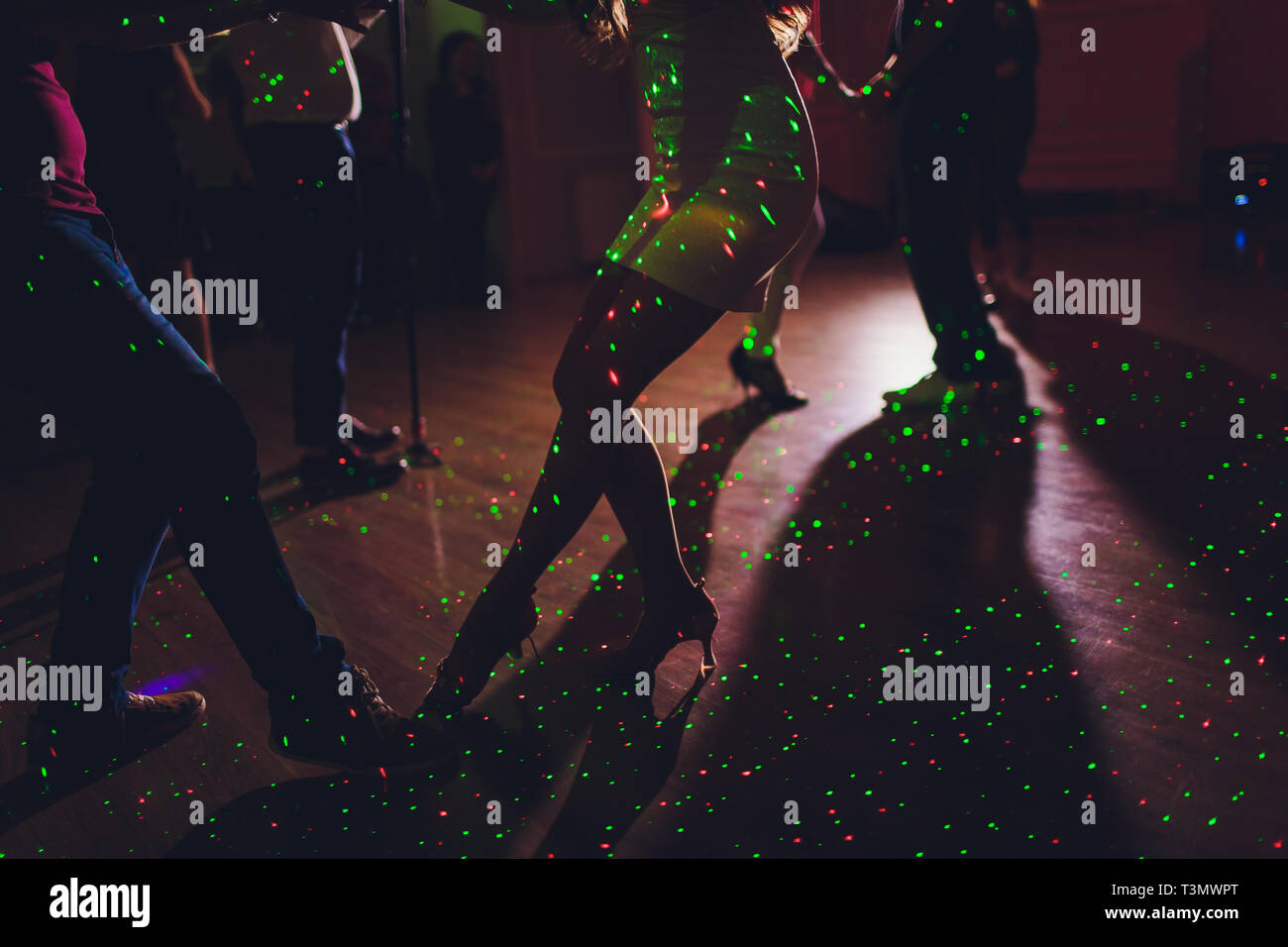 Legs of dancing people at the party Stock Photo - Alamy