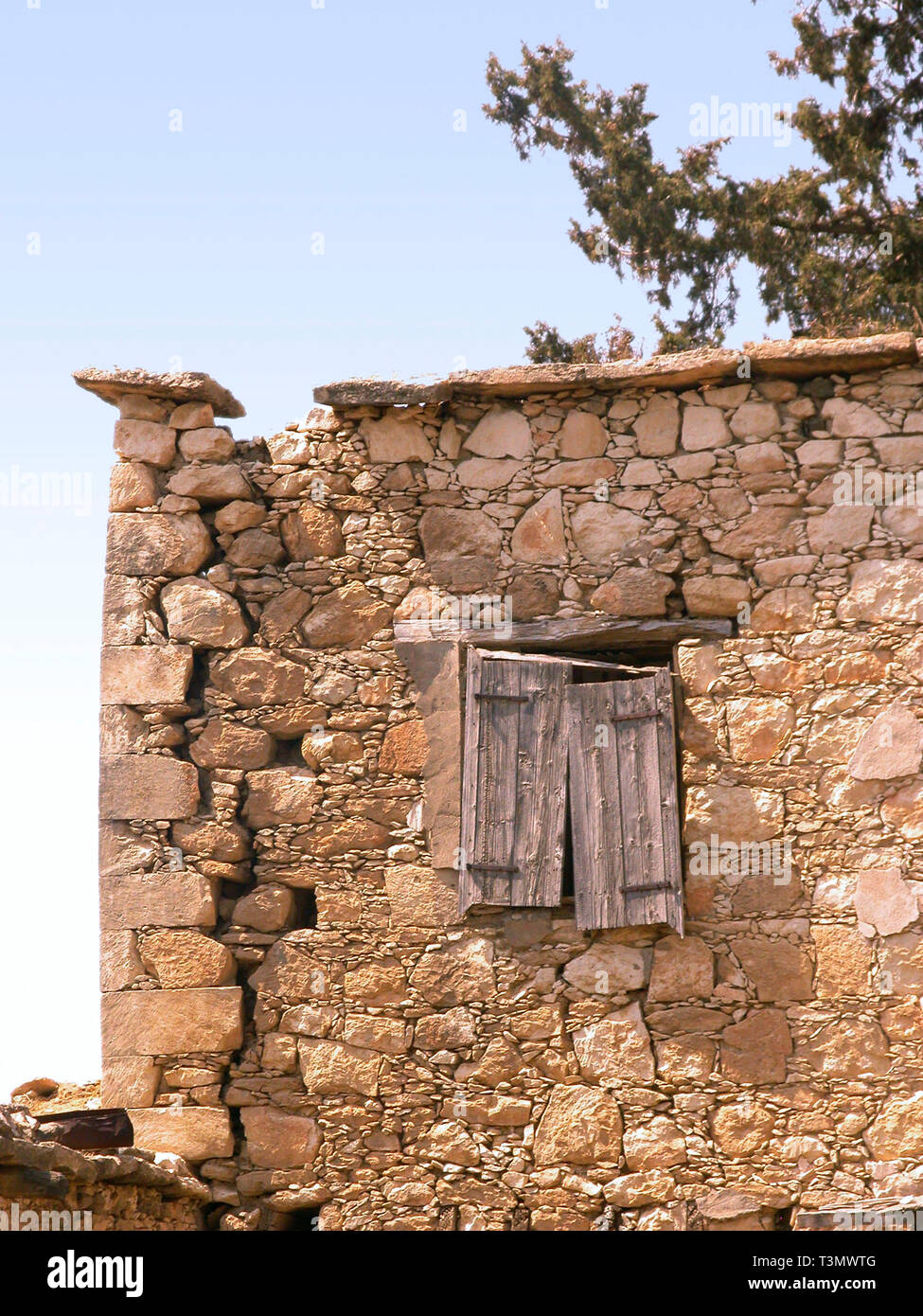 Ruined building awaiting renovation, with large cracks in wall and ...