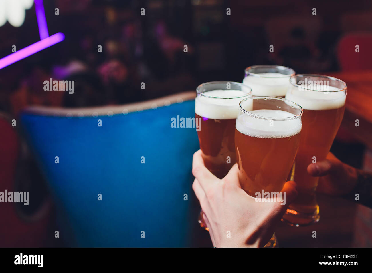 Barman hands pouring a lager beer in a glass Stock Photo - Alamy