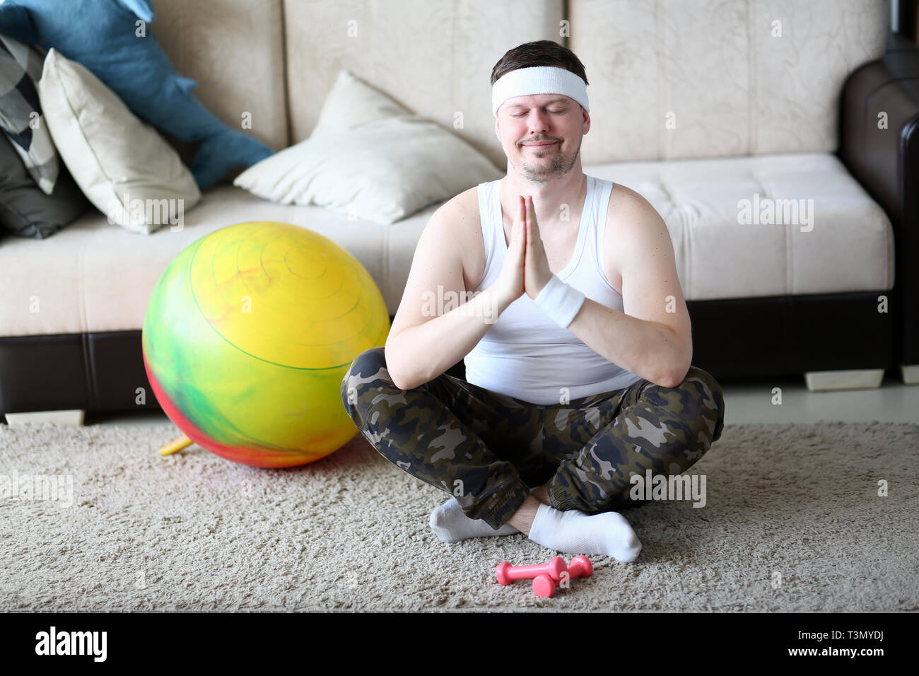 Male relaxing human body traning yoga Stock Photo - Alamy