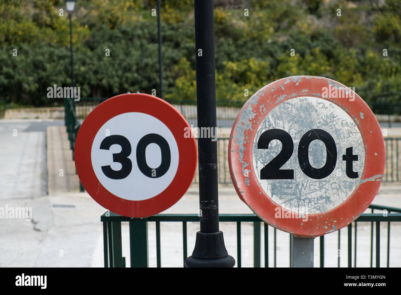 Two traffic signs with speed and weight limits Stock Photo - Alamy