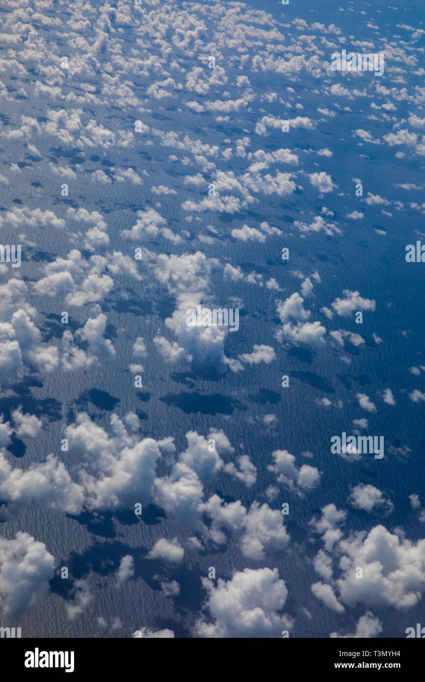 Clear Aerial view from aircraft window flying over Pacific Ocean in ...