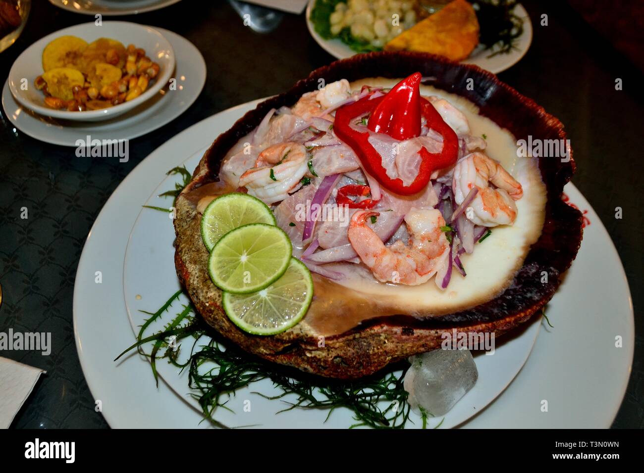 Typical ceviche presented in oyster shell -Restaurant in LIMA ...