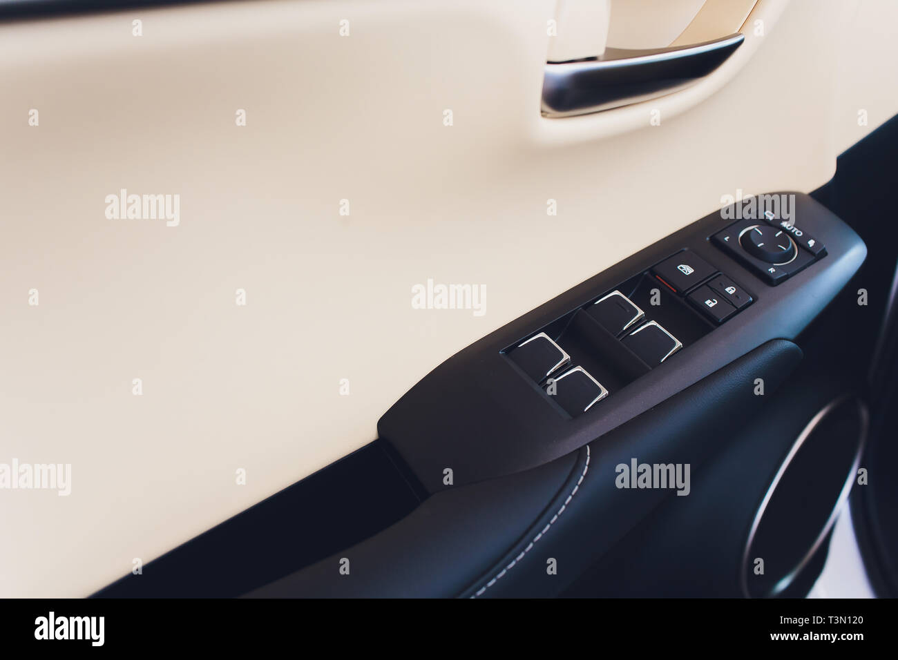 car leather interior details of door handle with windows controls and ...