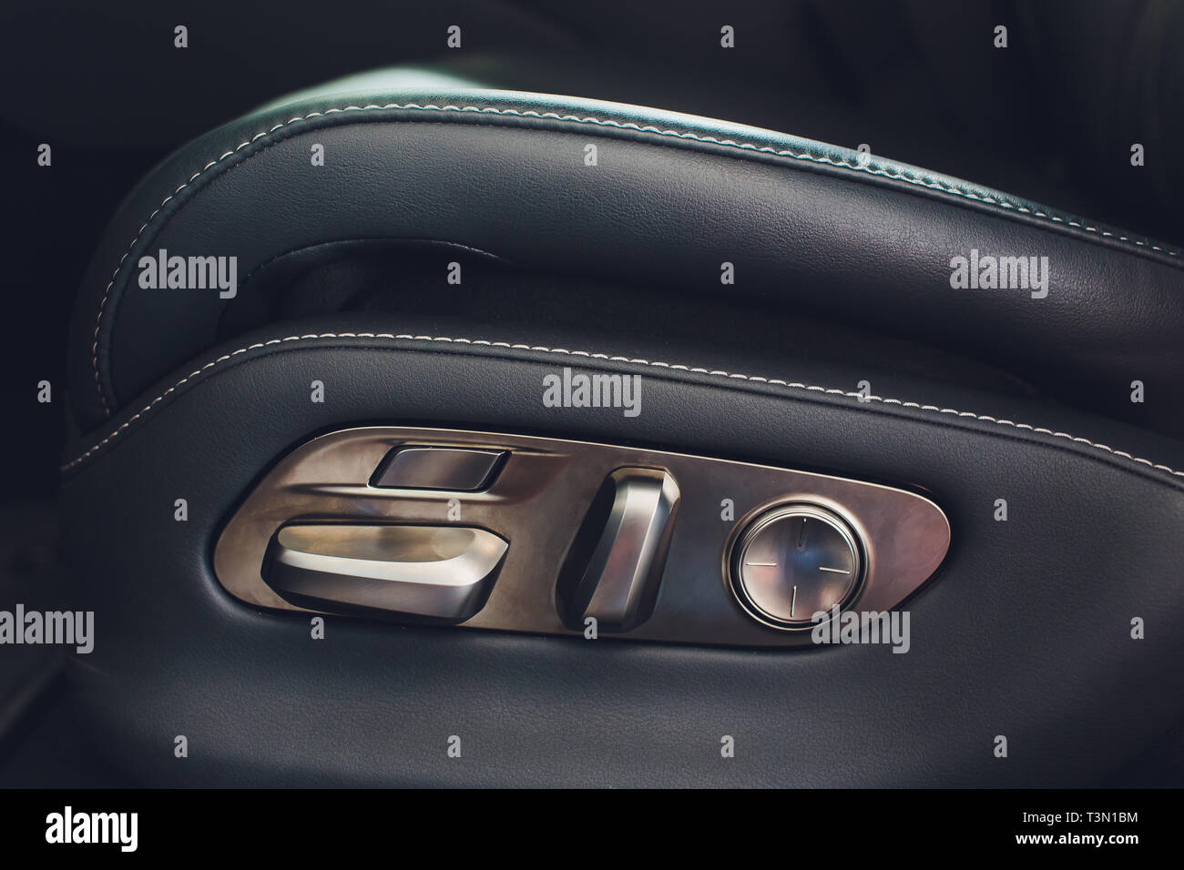 car leather interior details of door handle with windows controls and ...