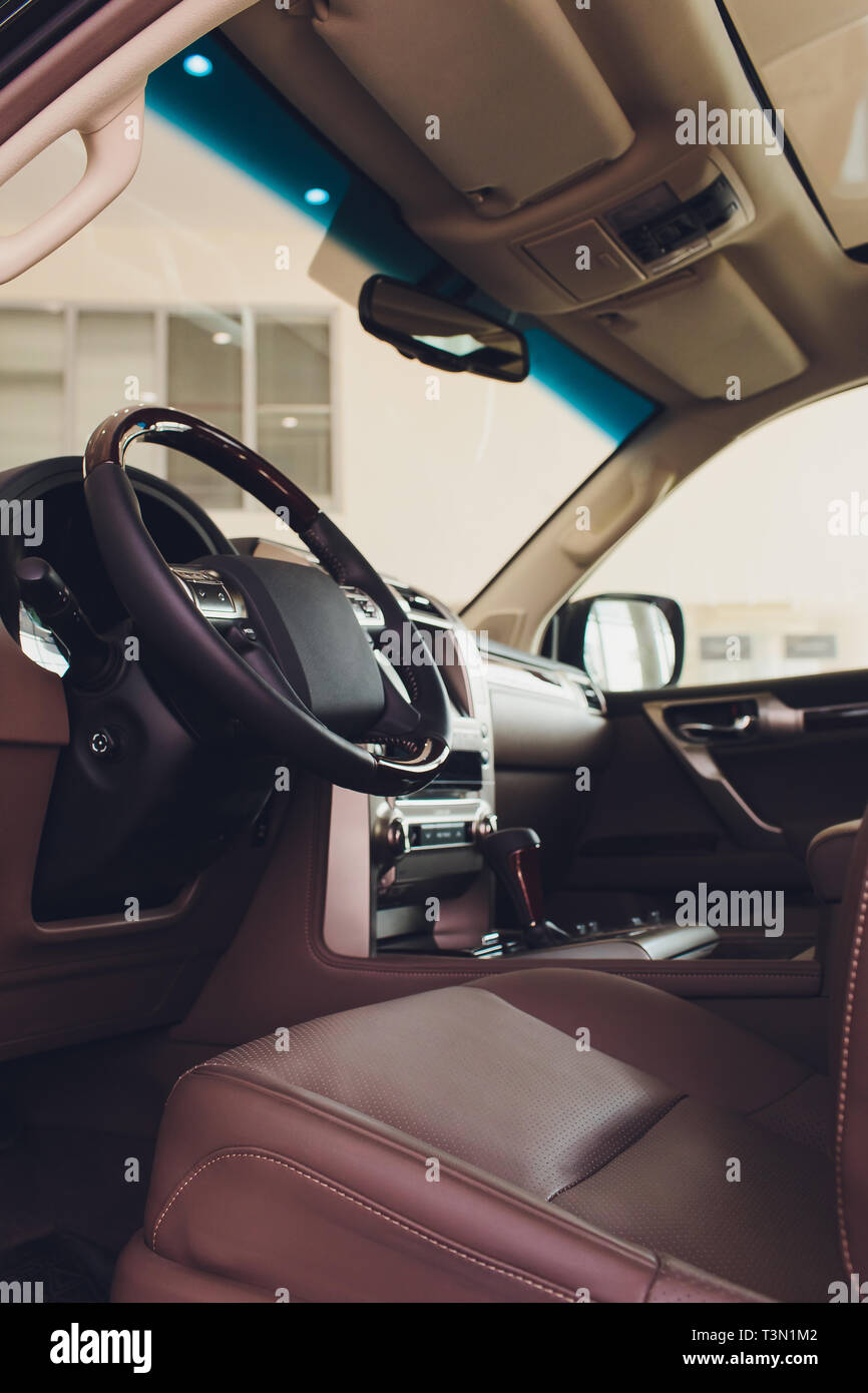 Dark luxury car Interior - steering wheel, shift lever and dashboard ...