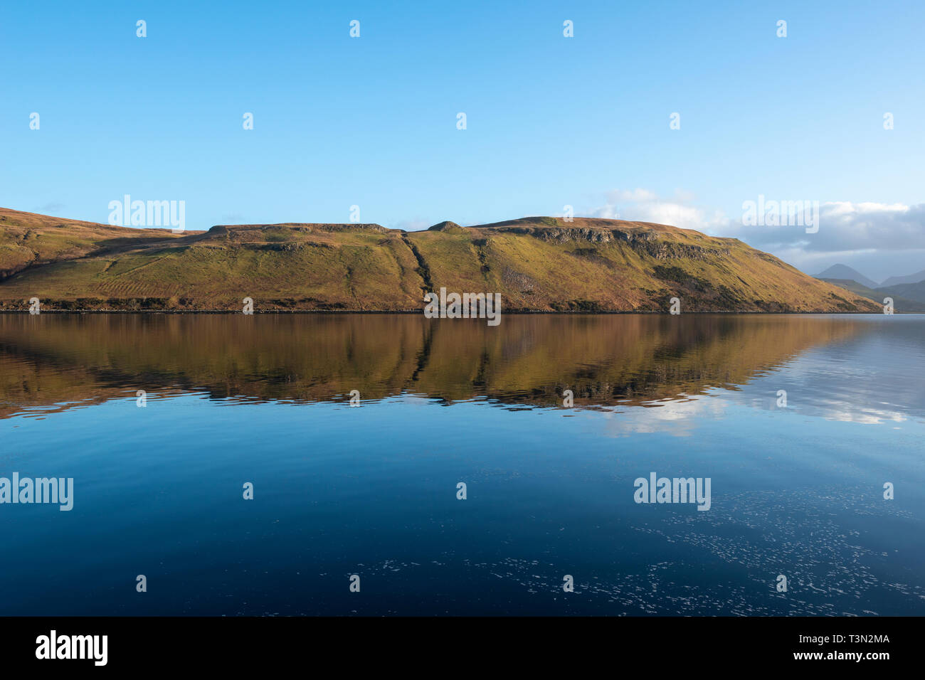 Colourful reflections in the calm water of Loch Harport on Isle of Skye ...