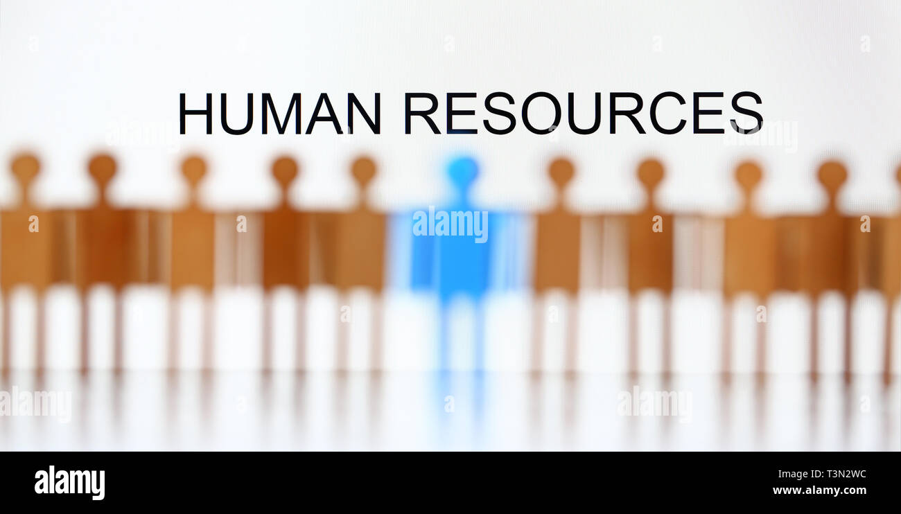 Human resources sign above line of toy human figures Stock Photo - Alamy