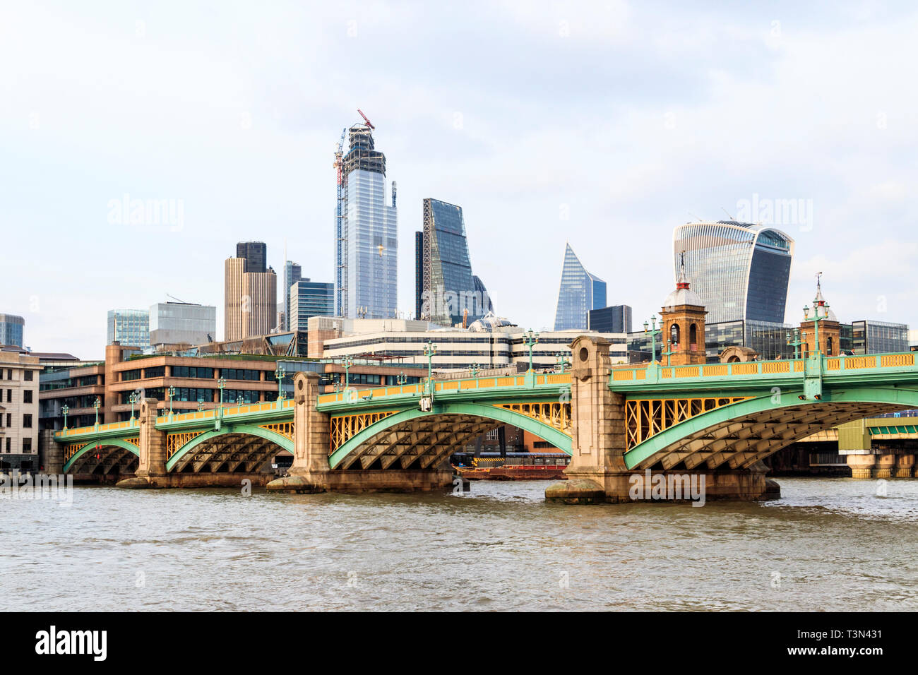 Southwark Bridge and the changing skyline of the City of London, across ...