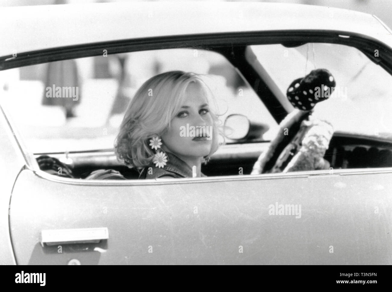 Unidentified blonde actress driving a car, 1990s Stock Photo - Alamy