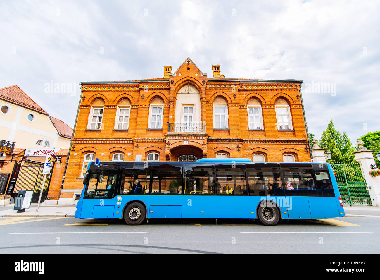 city bus station with blue bus Stock Photo - Alamy