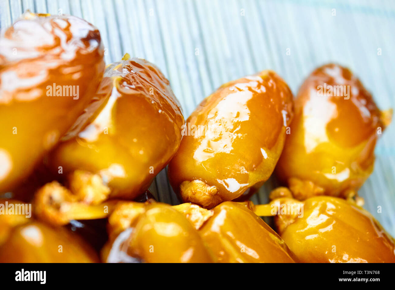 Sweet arabic algerian dates fruits on a wooden floor Stock Photo - Alamy