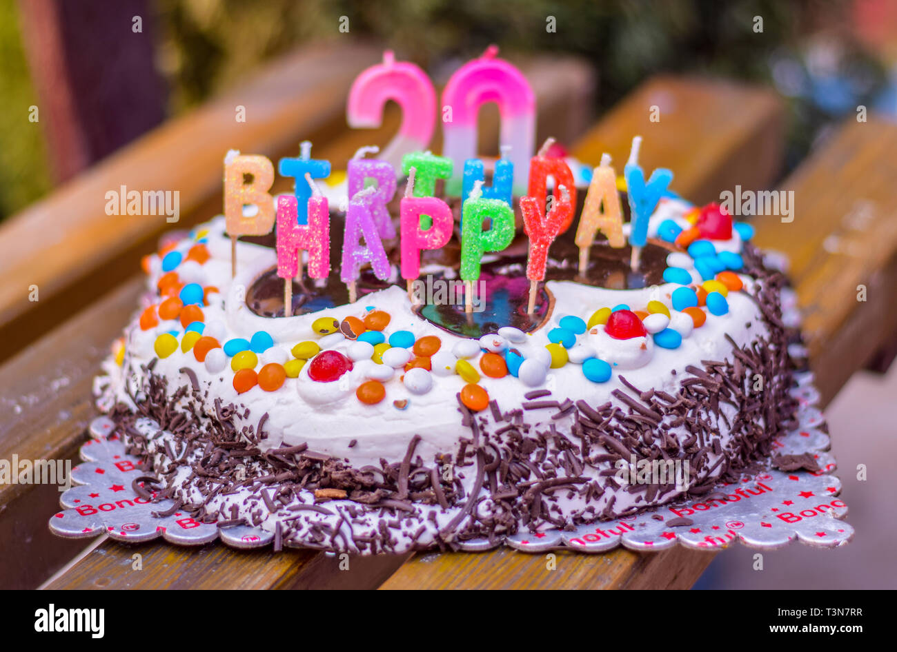 20 th chocolate Birthday cake with candles Stock Photo - Alamy