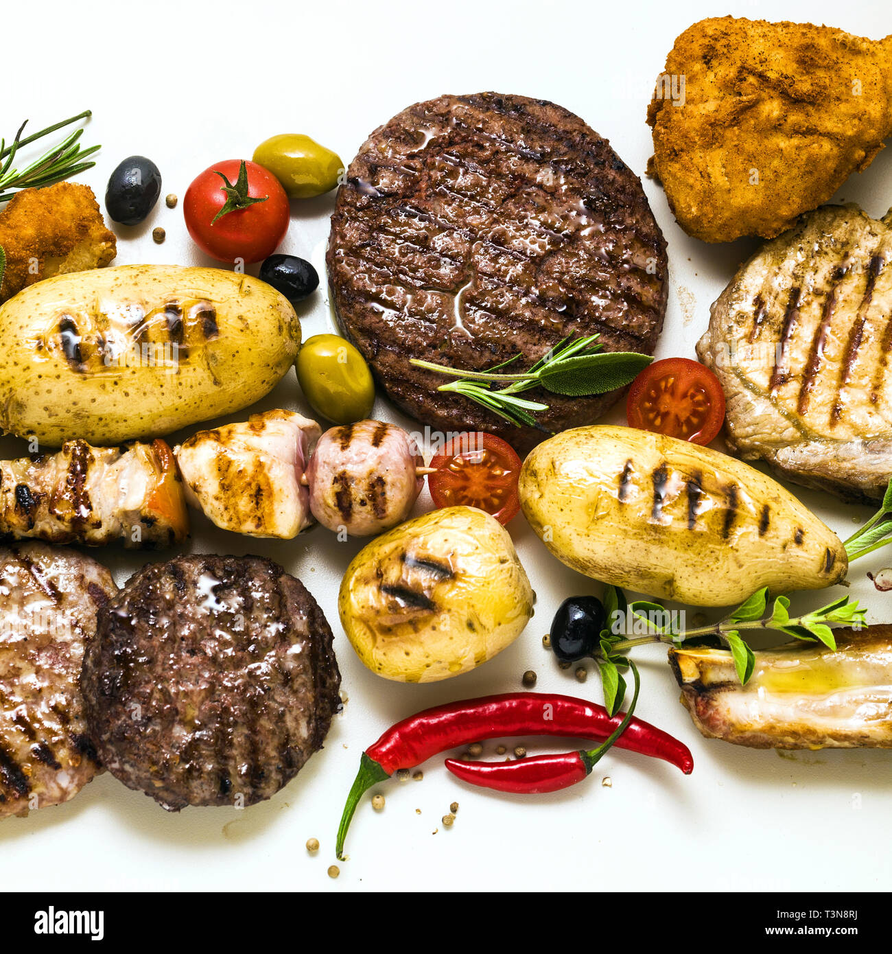 BBQ meat party with different types of meat: beef burgers, pork ribs ...