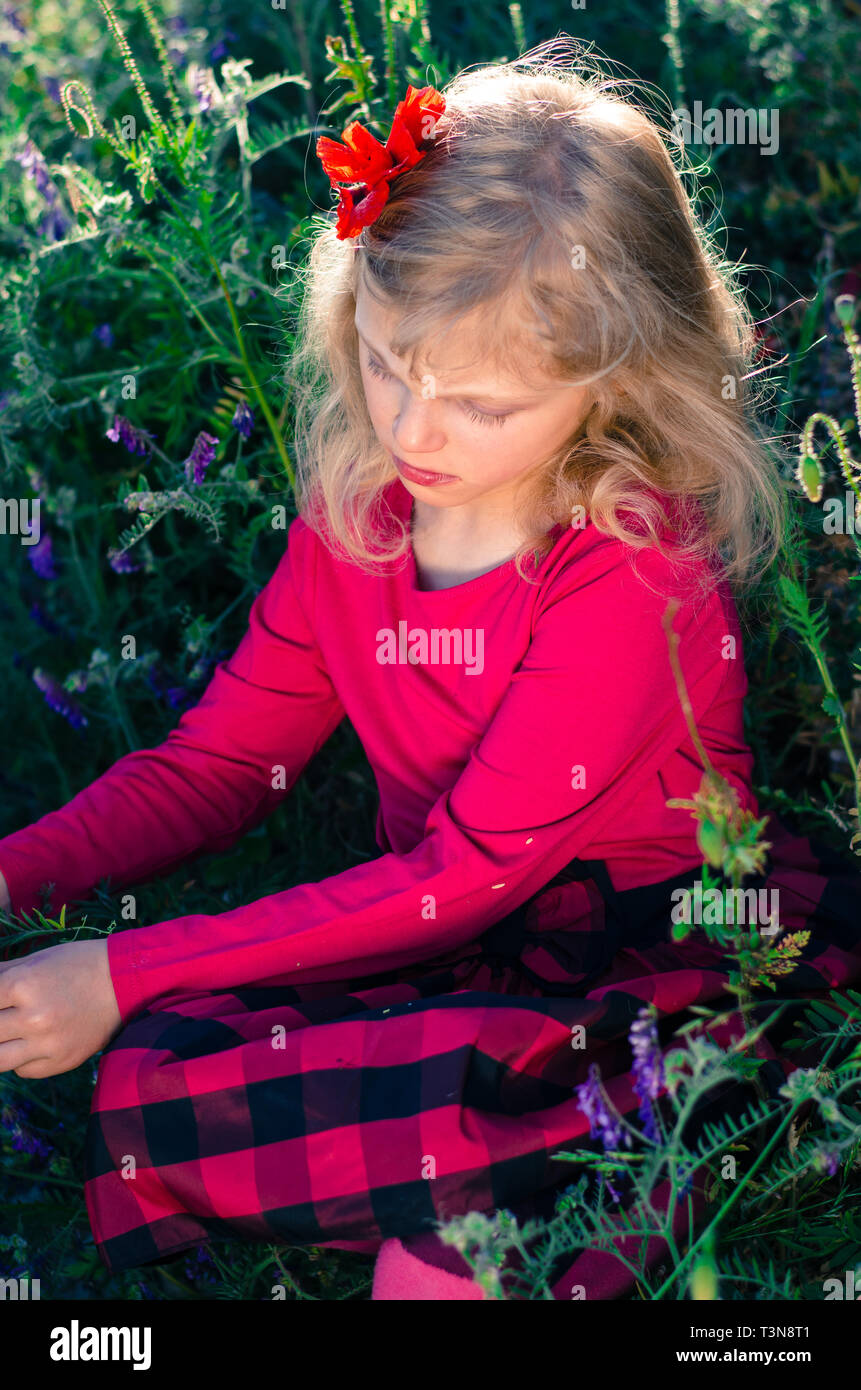 Girl sitting in flowers hi-res stock photography and images - Alamy