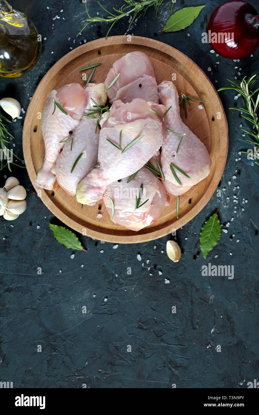 Raw uncooked chicken legs with ingredients for cooking, drumsticks on ...