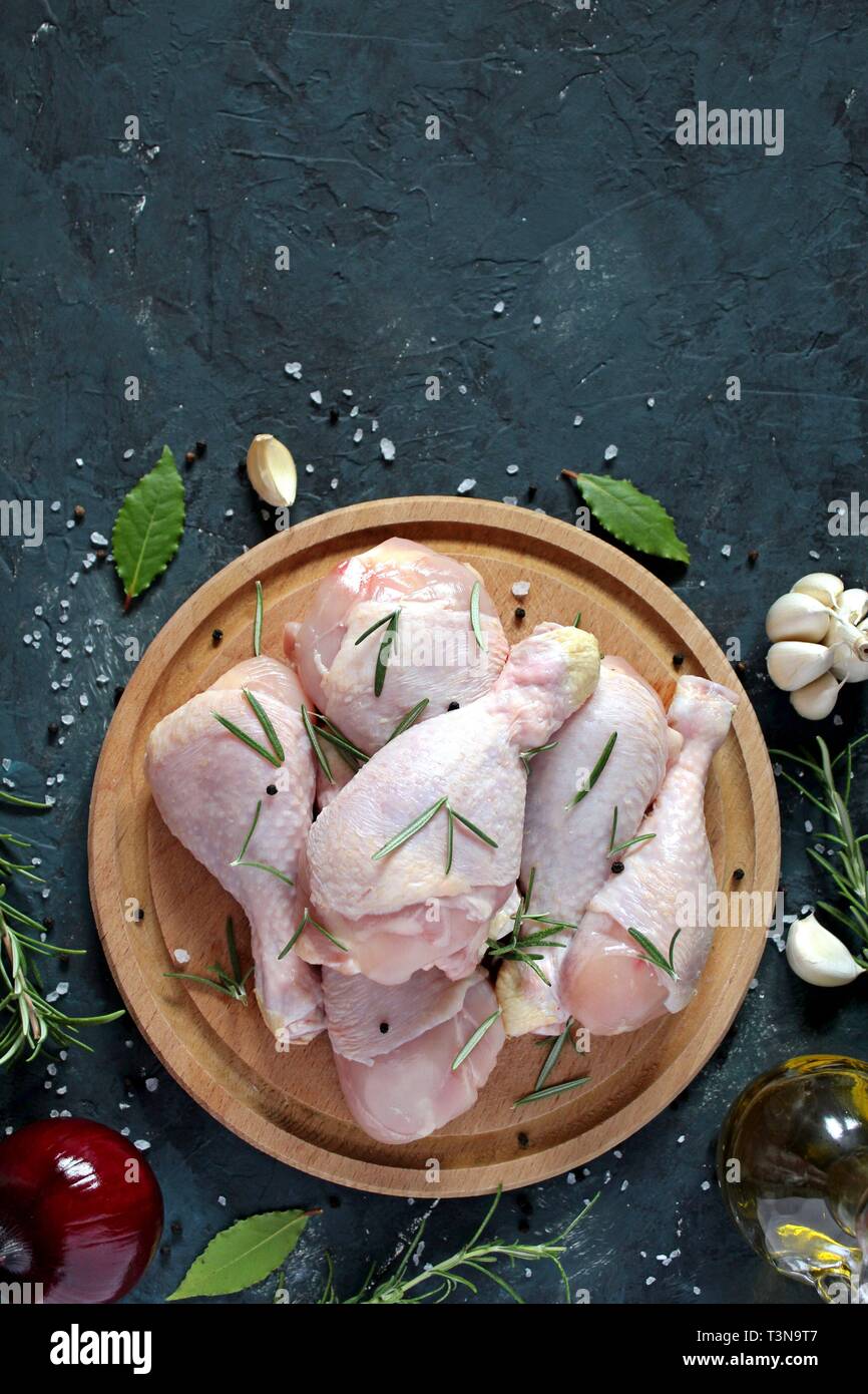 Raw uncooked chicken legs with ingredients for cooking, drumsticks on ...