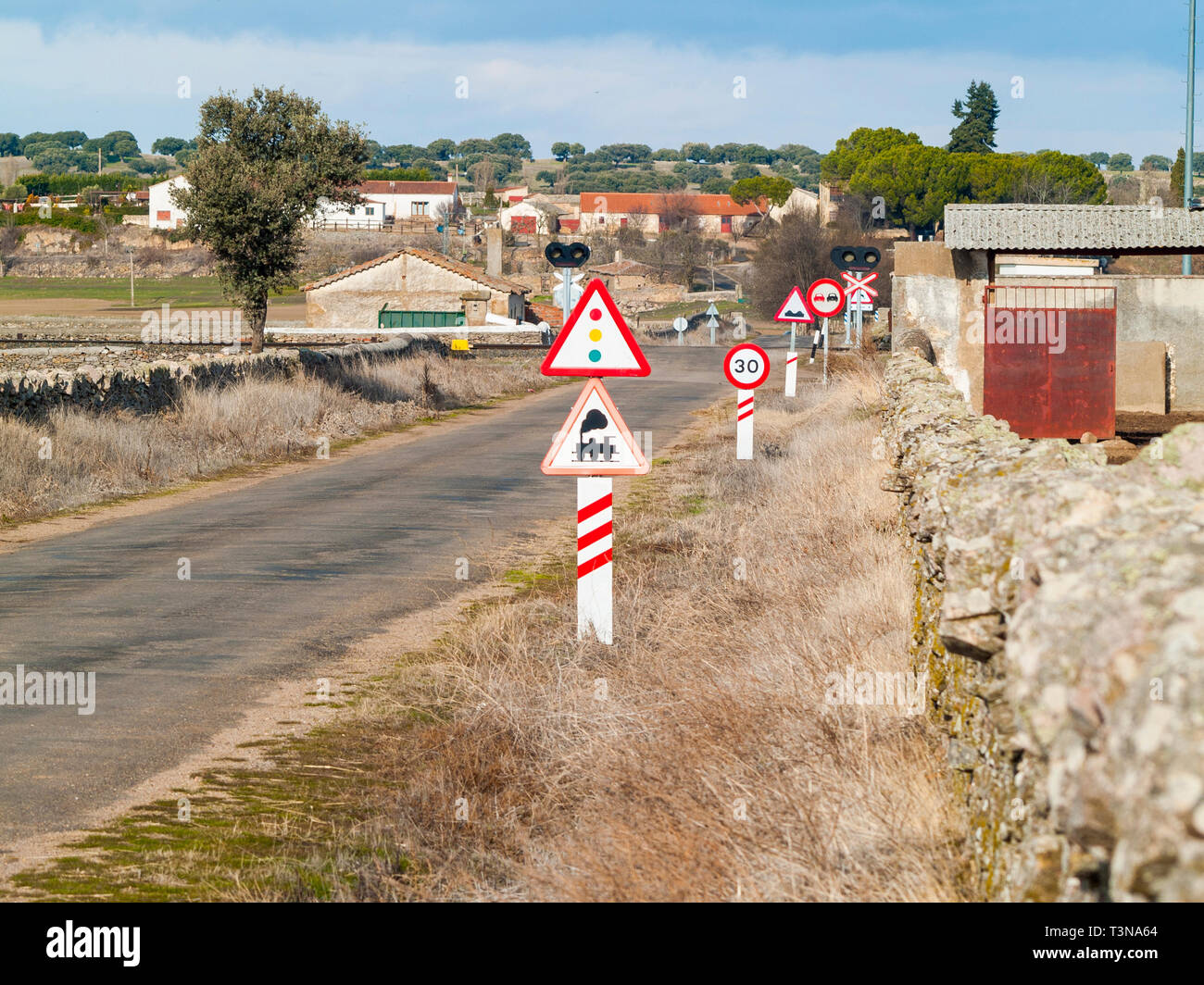 A dangerous rural road with train traffic signs Stock Photo - Alamy