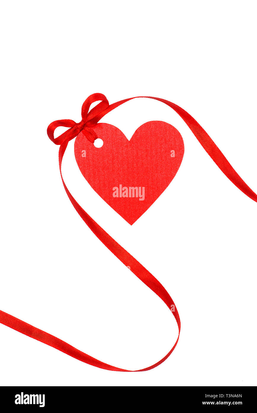 Heart tag with red ribbon isolated on white Stock Photo - Alamy