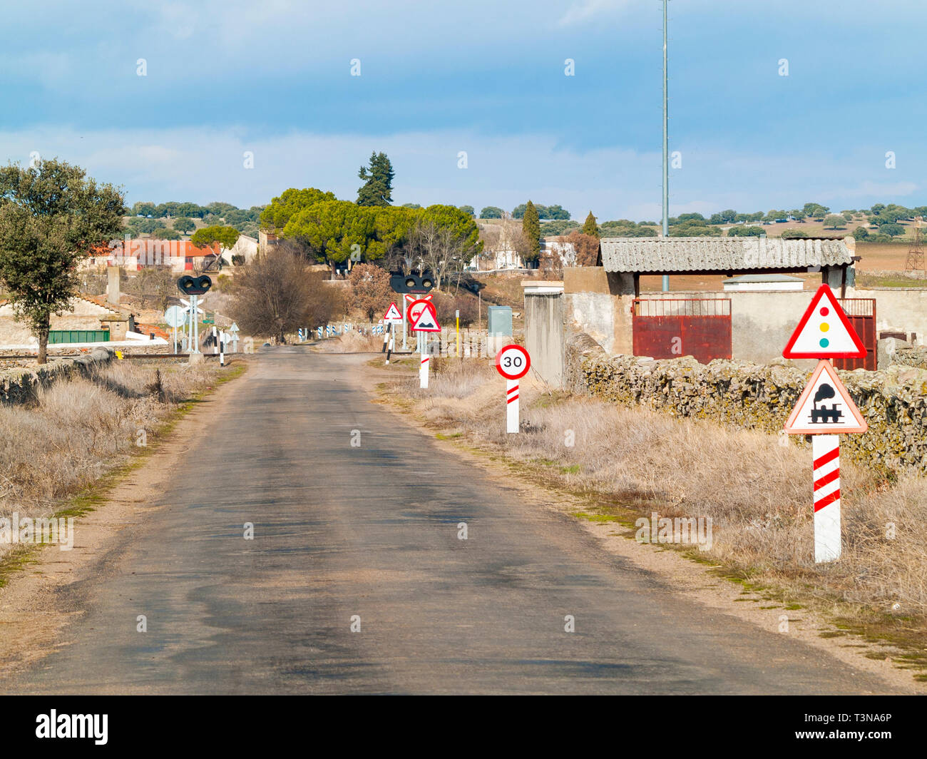 A dangerous rural road with train traffic signs Stock Photo - Alamy