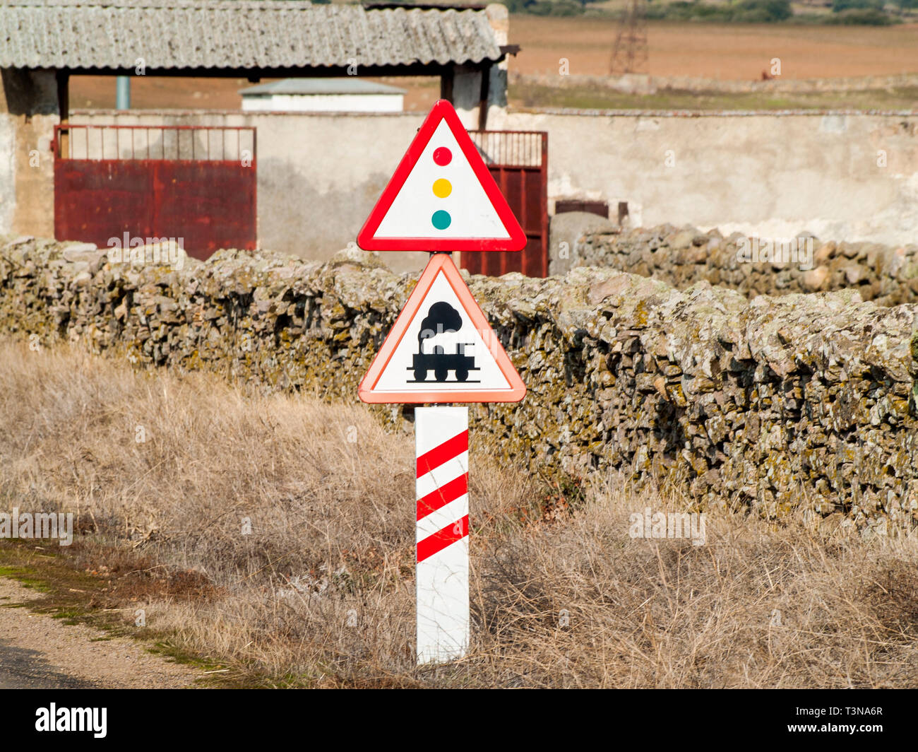 A dangerous rural road with train traffic signs Stock Photo - Alamy
