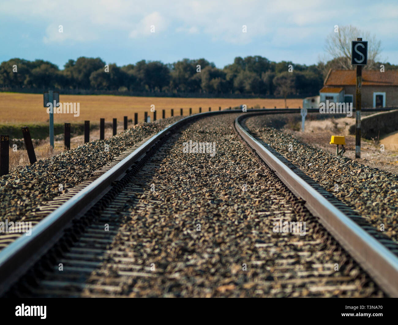 Rural landscape of a railway track and a small railway station Stock ...